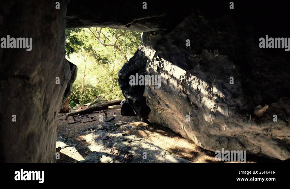 shot taken from inside a small cave looking out Stock Video Footage - Alamy