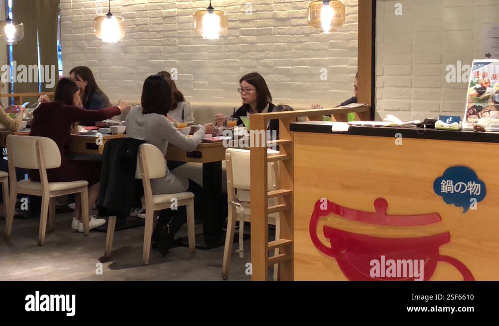 The motion of people eating food inside the restaurant with 4k ...