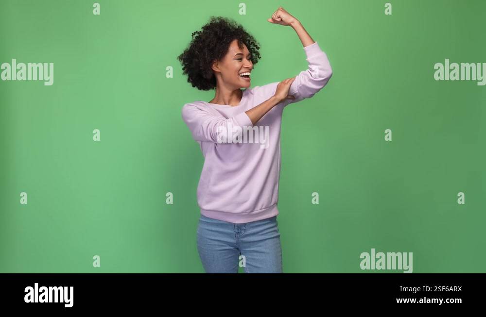 Lady showing muscles arms gym practice isolated vibrant coor background ...