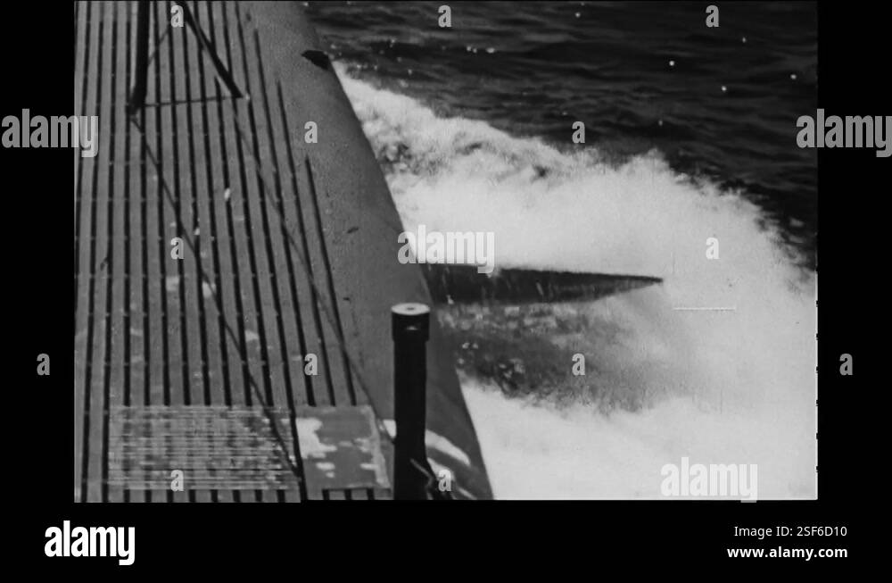 1940s: Ship. Submarine moves through water. Bow plane closes ...