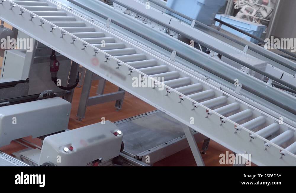 Belt conveyor and gravity roller conveyor is a transport line for ...