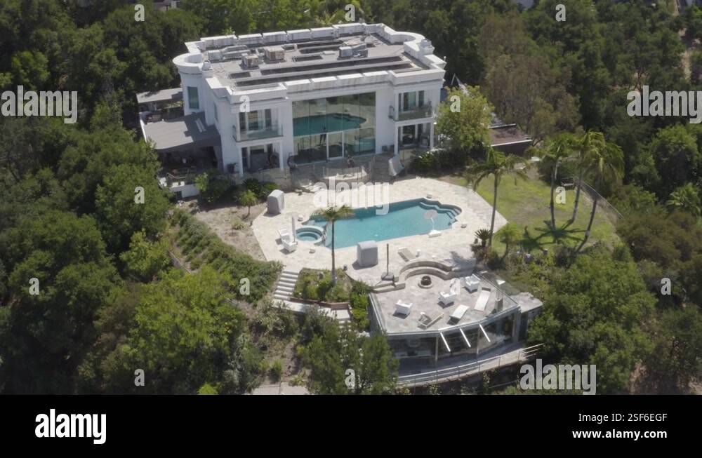 Aerial of a multi level Hollywood Hills mansion with deluxe swimming pool Stock Video Footage ...