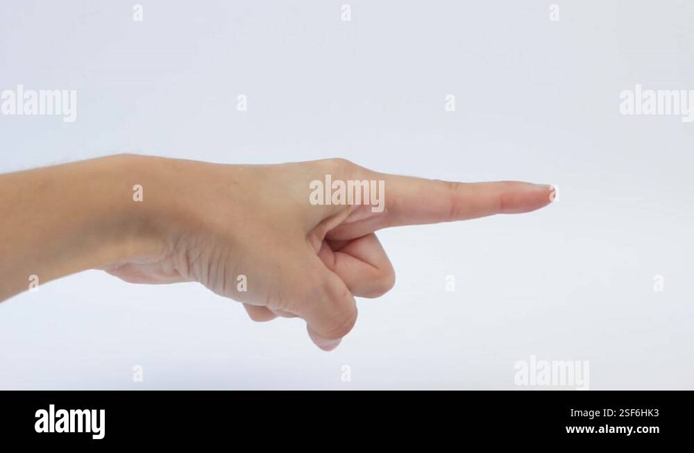 Female index finger on a white background points to the side Stock ...