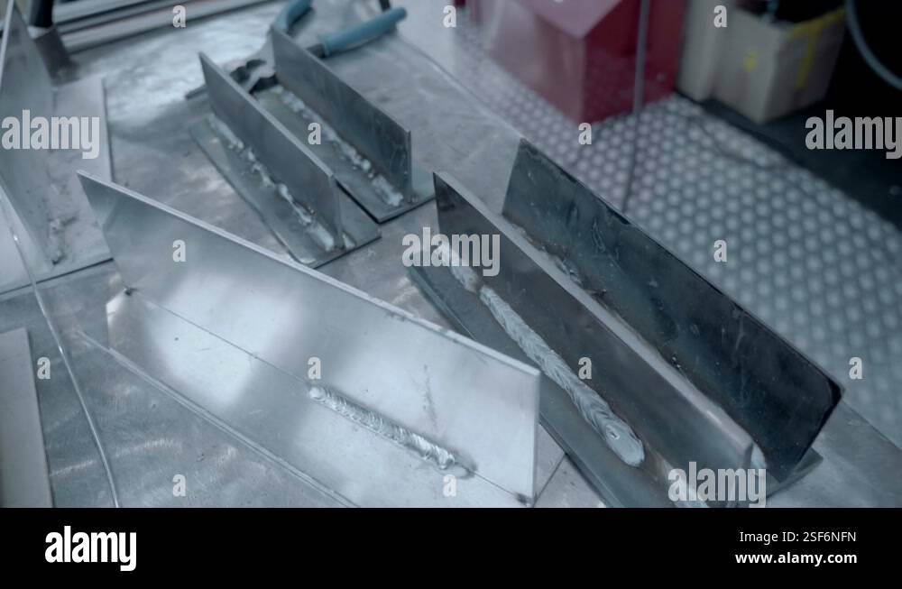 Welding seam on rough metal workpieces and parts attached to the ...