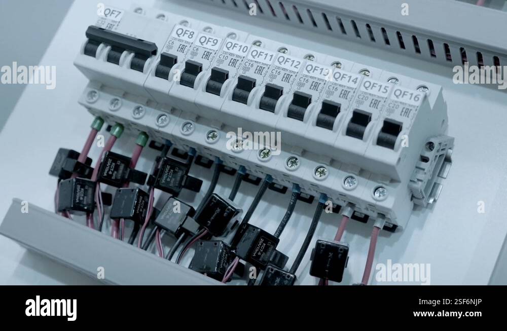 Row of electric switches and many split current transformers for each ...