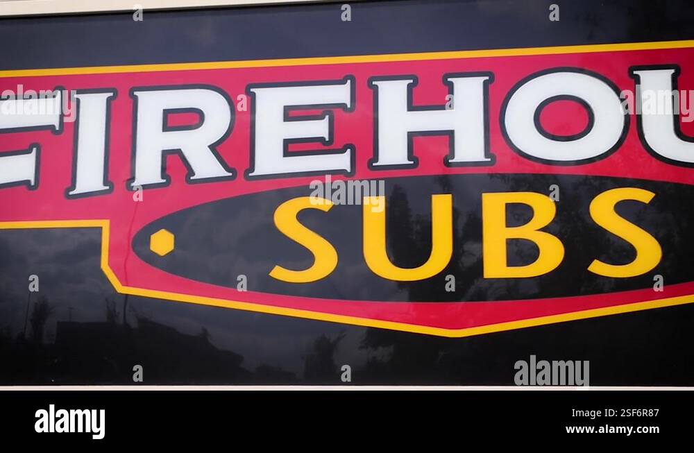 Firehouse Subs restaurant street sign slow pan Stock Video Footage - Alamy