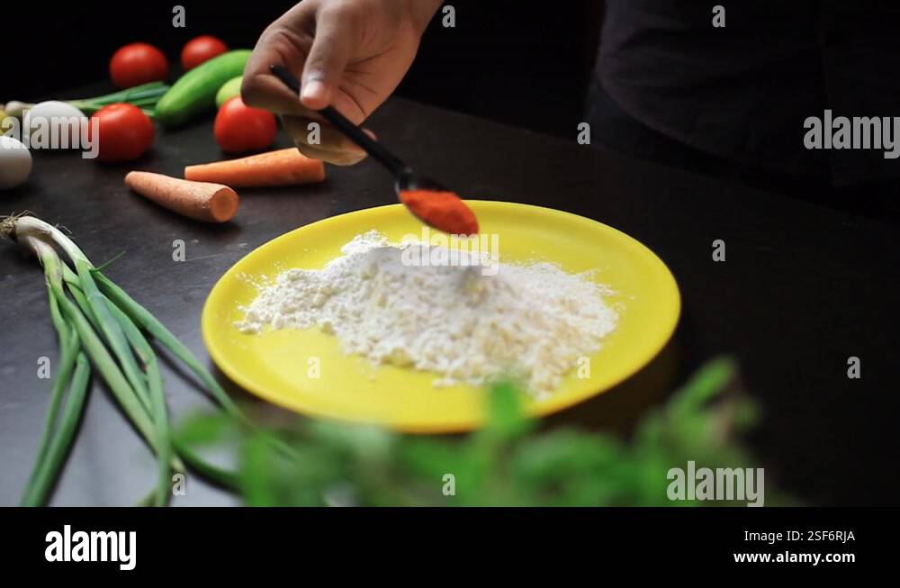 Adding paprika powder to flour mixture, masala, spices Stock Video ...