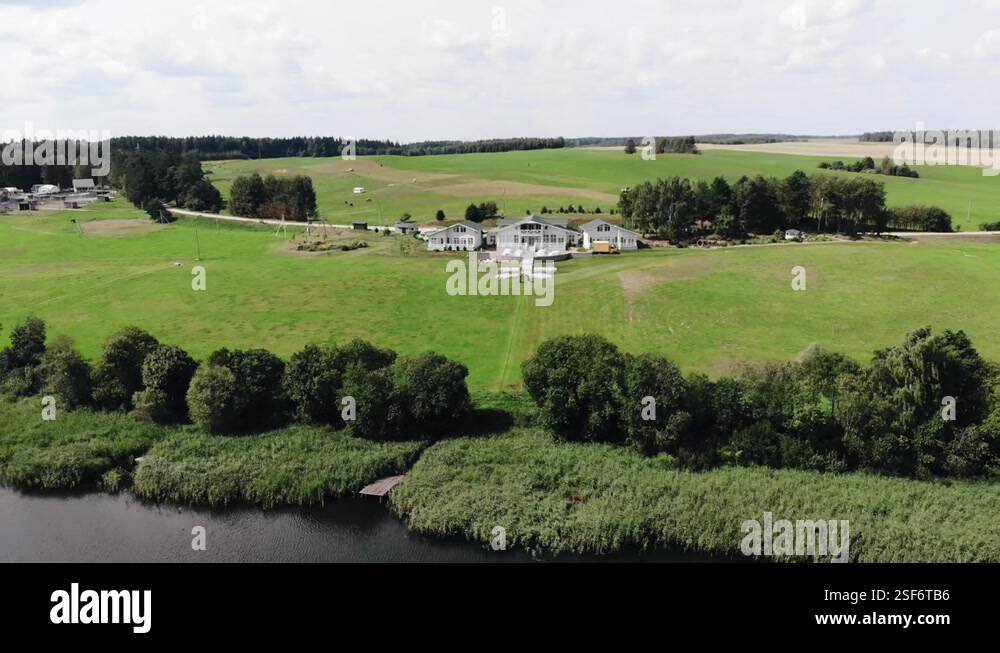 Aerial view of country cottage with outbuildings in the countryside by ...