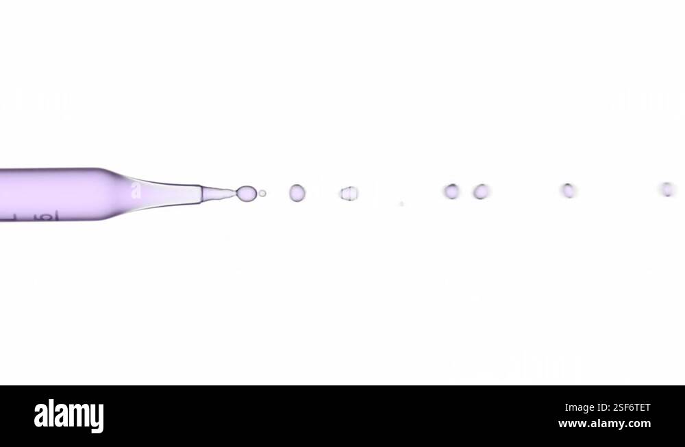 Purple fluid flows from graduated lab dropper Stock Video Footage - Alamy