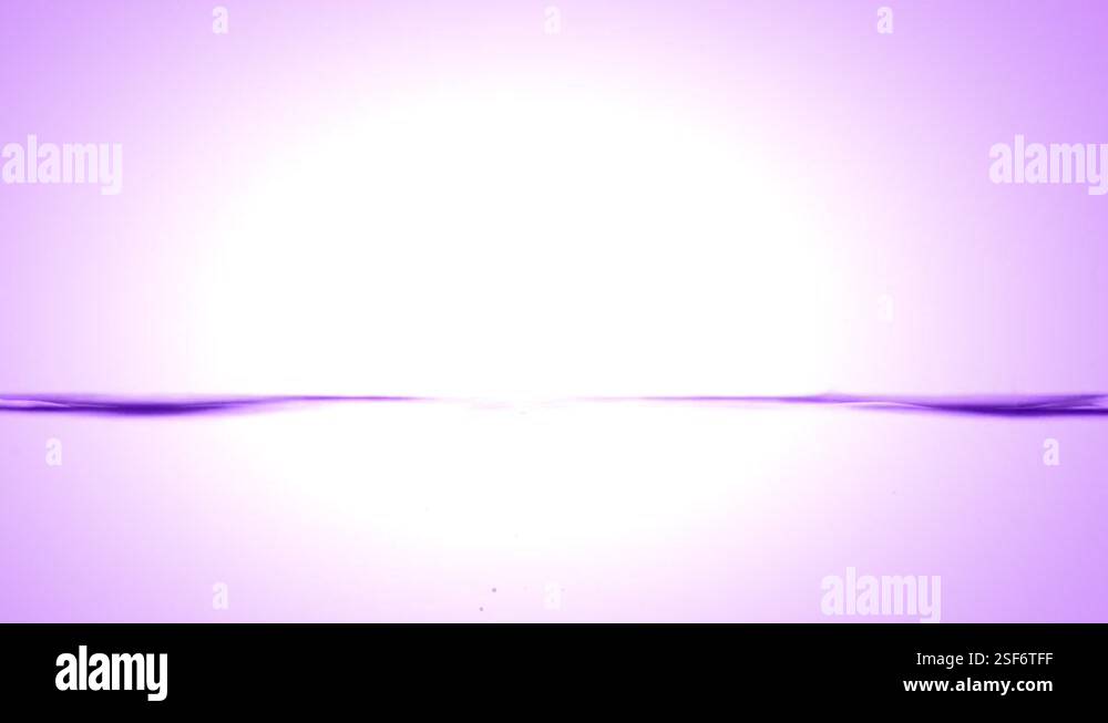 Violet drop falls down on violet liquid surface creating ripples Stock ...