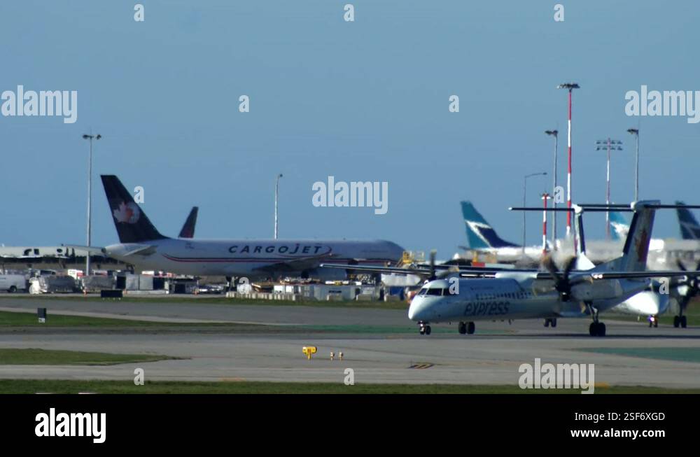 Two Air Canada Express Plane, Dash 8 Q400 Taxiing at Vancouver Airport ...