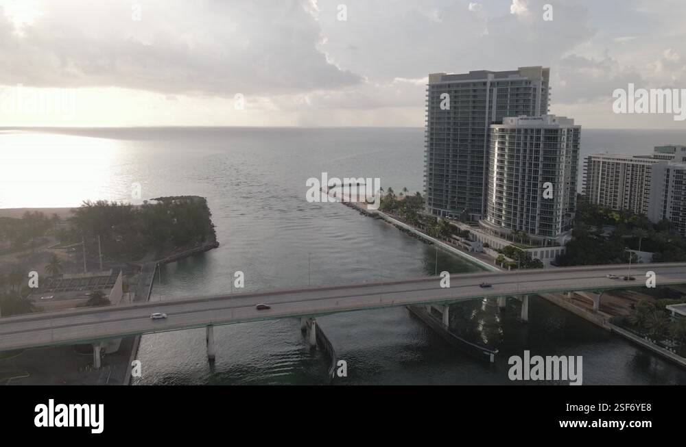 Sunrise aerial: Haulover Inlet channel and Collins Ave Bridge, Miami ...