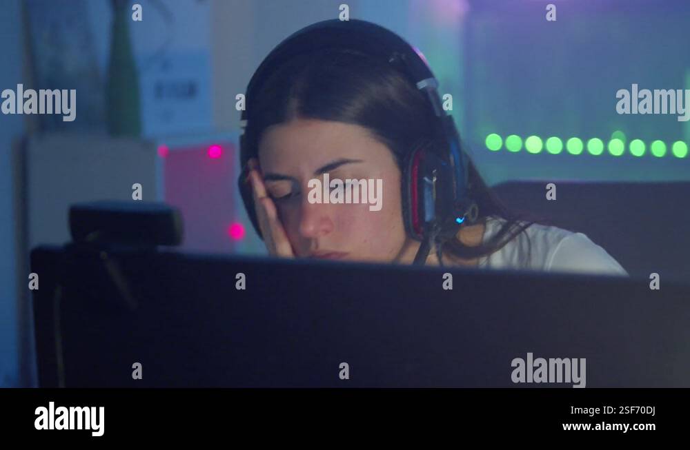 Close up of young gamer woman boring during video game at home Stock ...