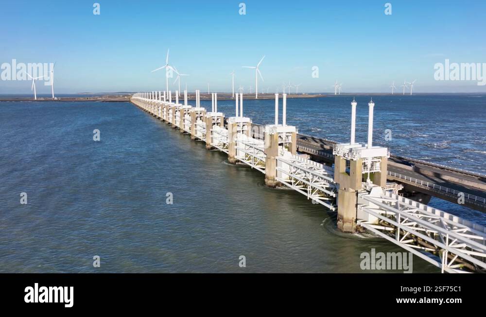 Long aerial shot zooming out of the Eastern Scheldt storm surge barrier ...
