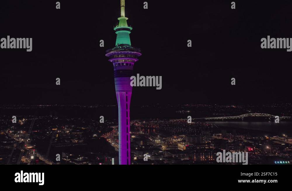 Aerial: Light show of sky tower, bridge and fireworks, Auckland city ...