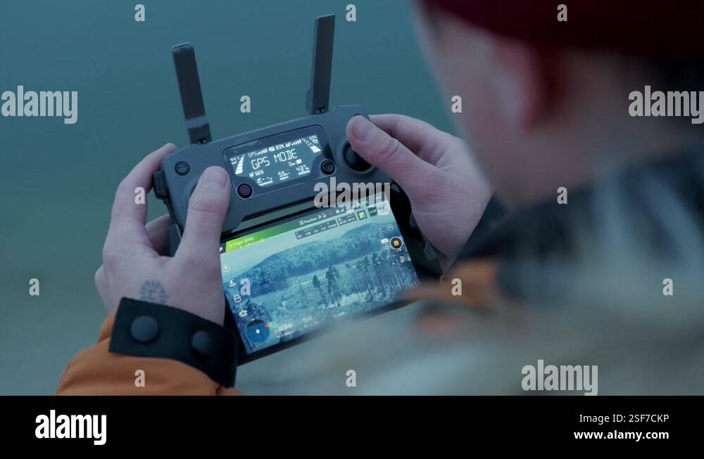 The guy controls the drones. remote control of the drone in hands is ...