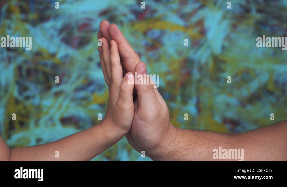 Close up view of two palms touch each other. Father and son holding hands Stock Video Footage ...