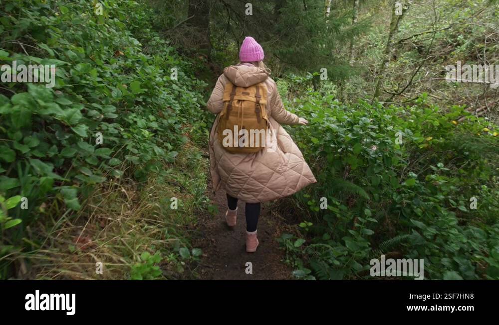 Traveler woman walking by nature trail, Eco and bio-tourism concept ...