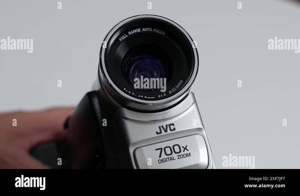 JVC videocamera from the '90s in your hand man. A man opens the ...