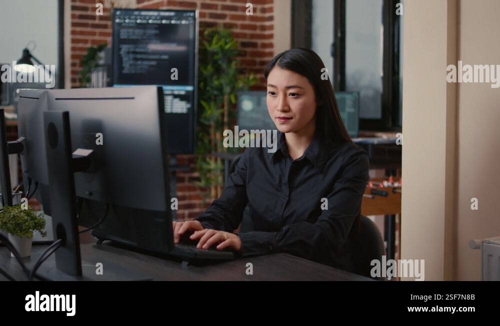 Smiling software developer typing machine learning app code on computer keyboard Stock Video ...