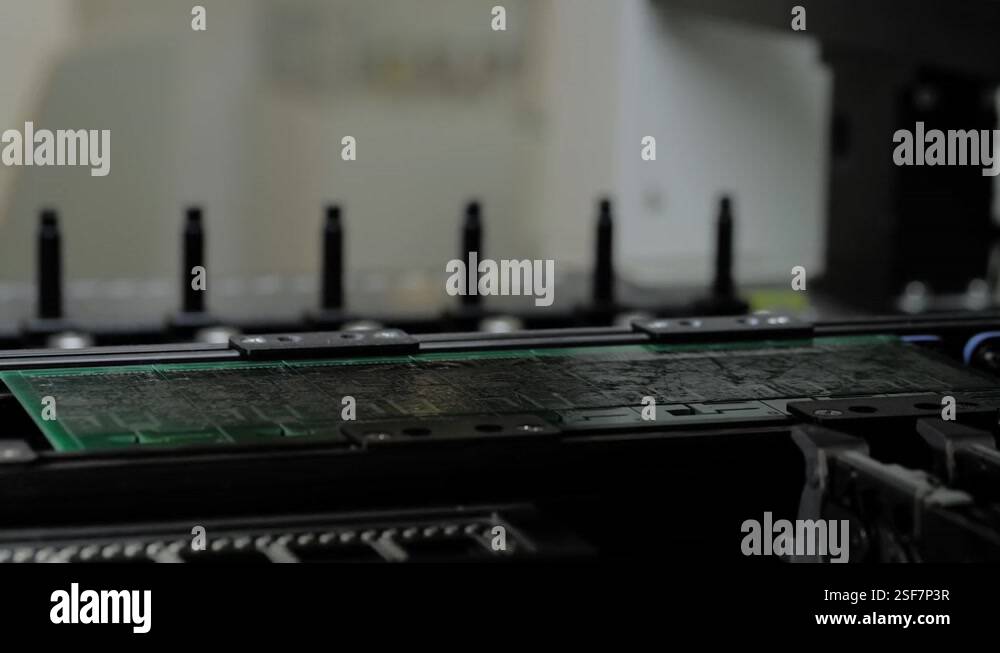 SMT pick and place machine installing SMD electronic components at ...