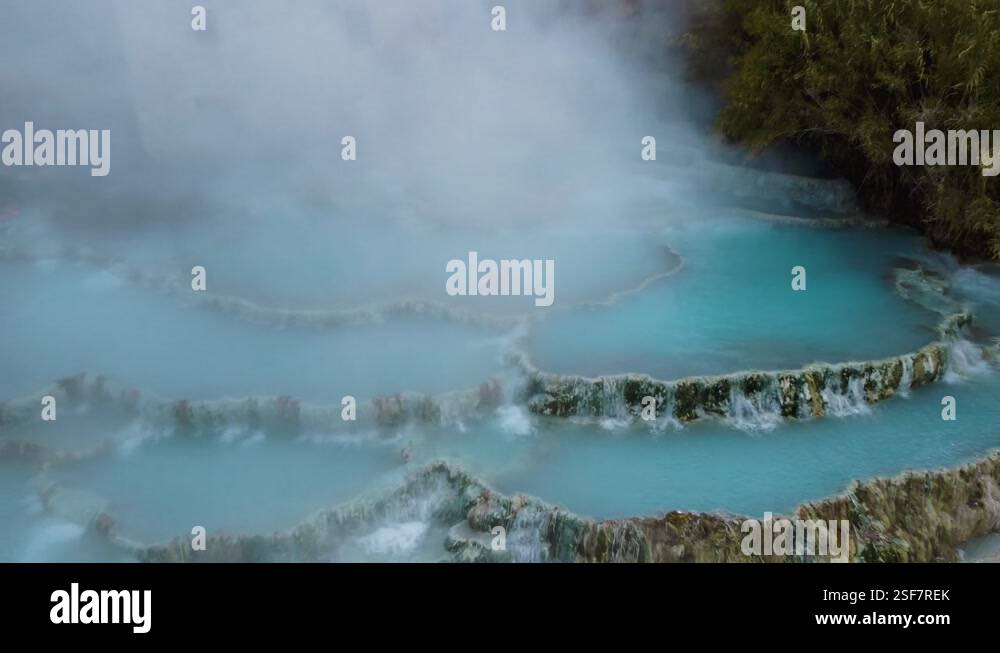Young couple at travel destination Saturnia, geothermal hot springs ...