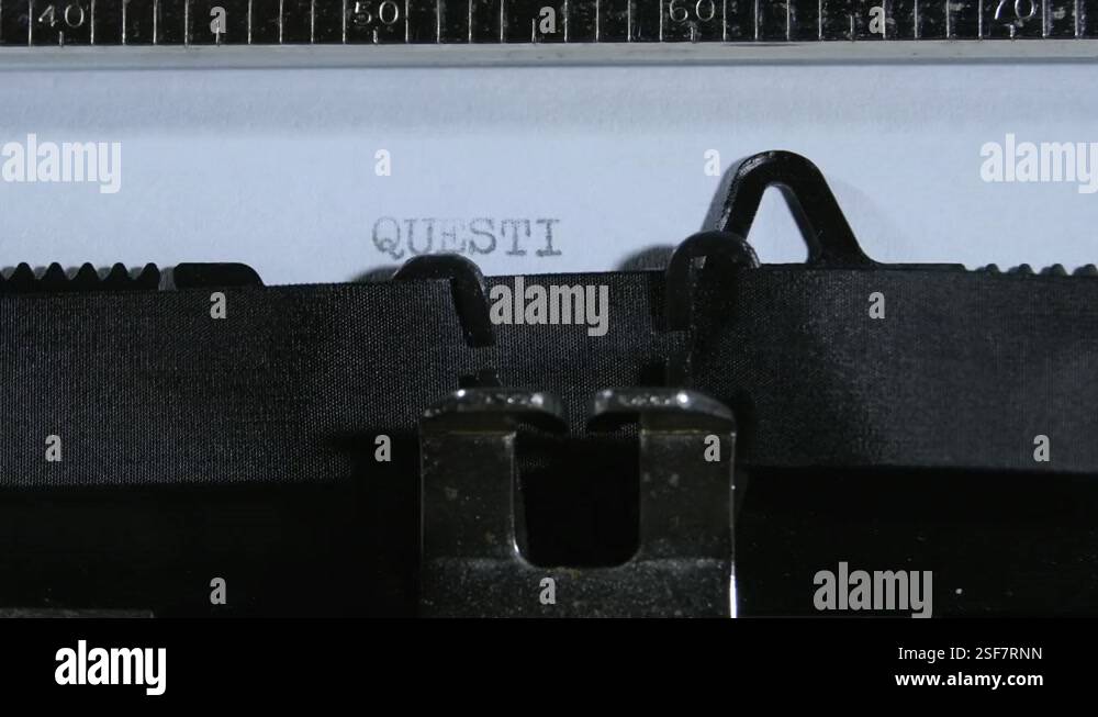Typing QUESTIONS with an old manual typewriter Stock Video Footage - Alamy