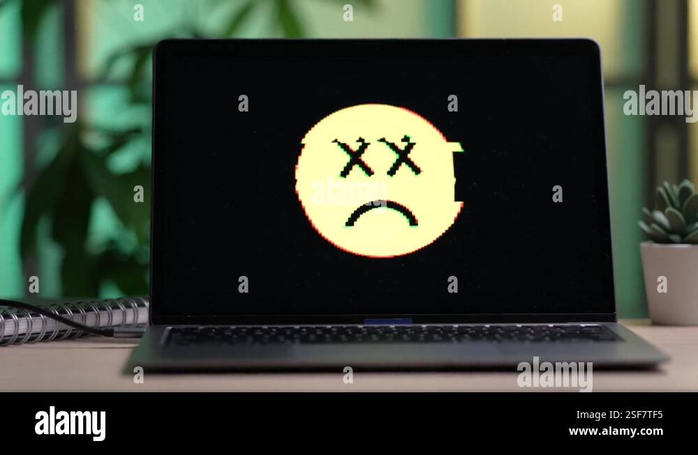 Laptop Computer Screen With a Sad Face Emoji on Display Stock Video ...