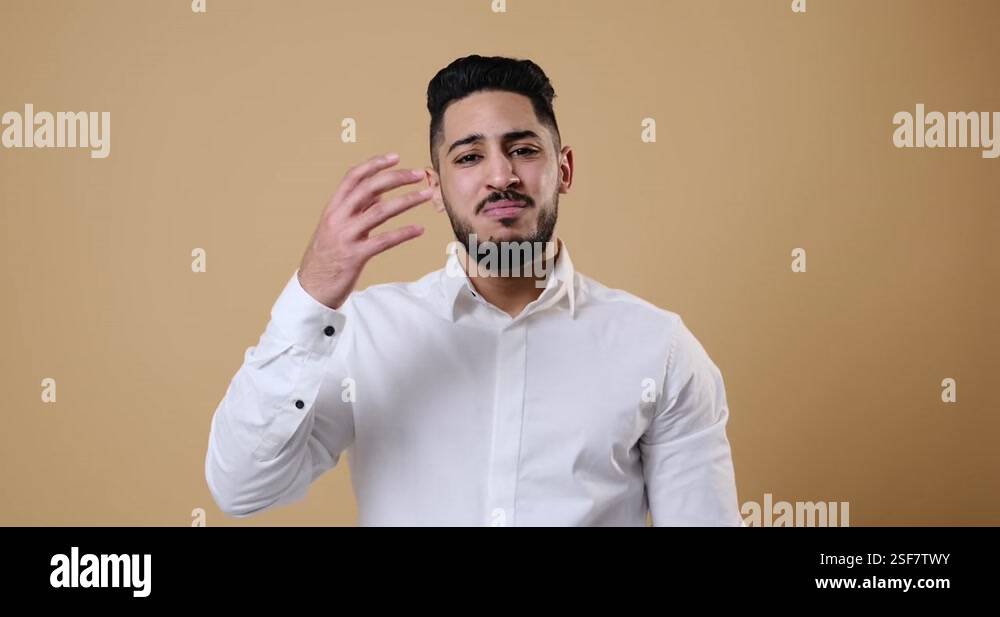Confused businessman shaking head over beige Stock Video Footage - Alamy