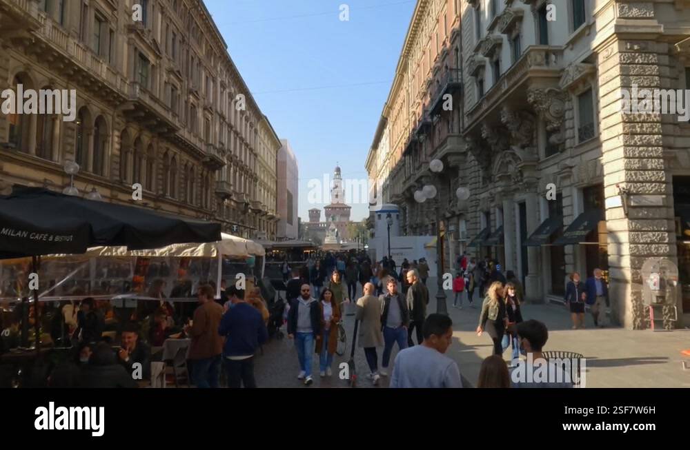 Via Dante pedestrian street in Milan with people strolling and shopping ...