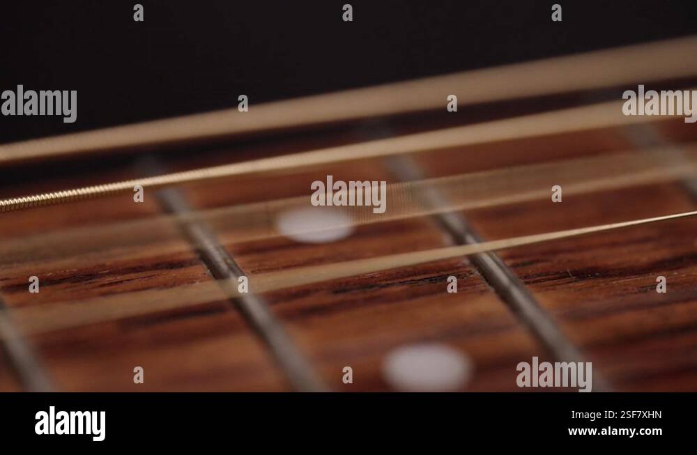 A string moves in very slow motion after being plucked Stock Video ...