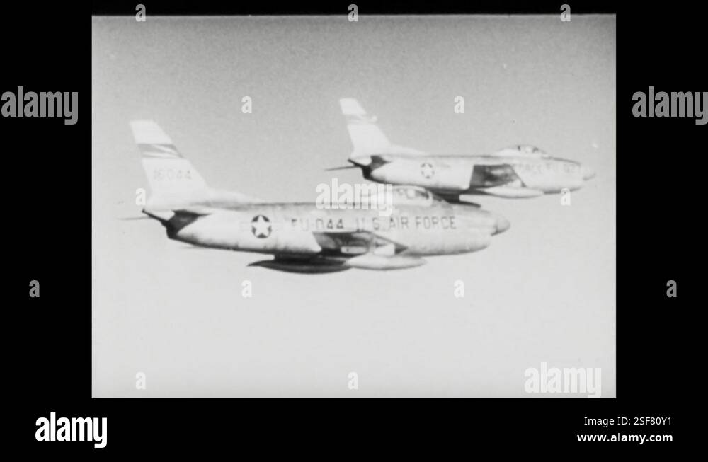 1940s: Two jets in flight, pilot in cockpit. Information readout in ...