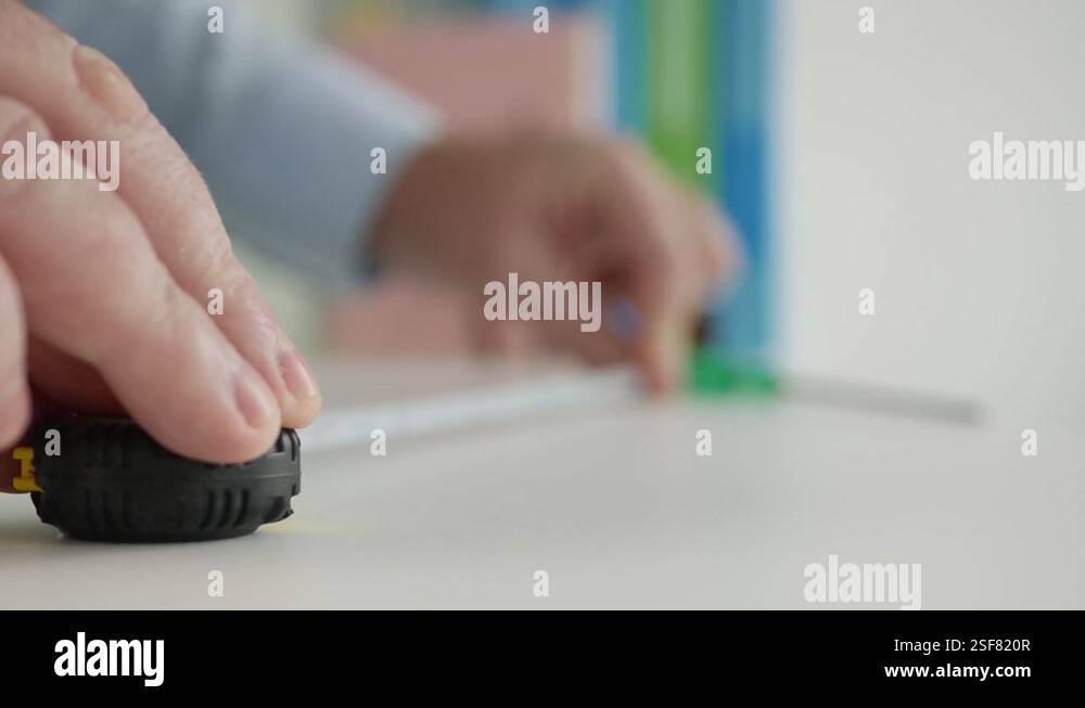 Engineer's Hands Using a Tape Measure and Checking Horizontal Surface ...