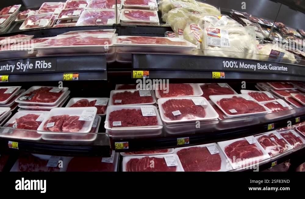 Walmart retail interior pan of red meat case and prices Stock Video ...