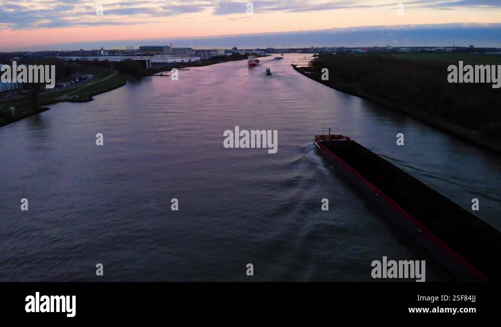 Aerial Over Empty Cargo Barge Ship Travelling Along Oude Maas In Late ...