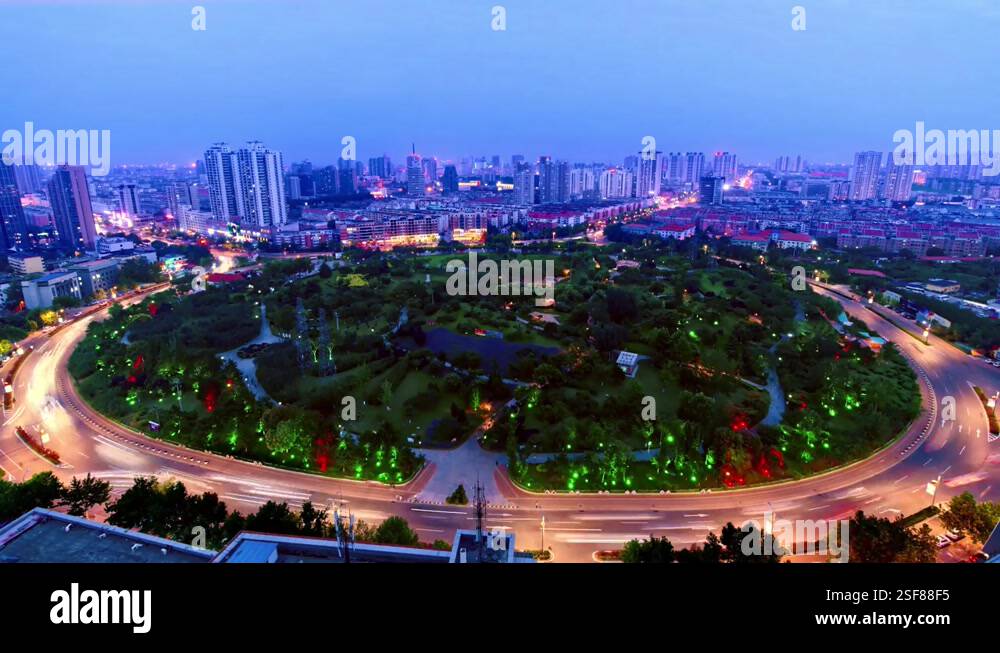 Time-lapse of a roundabout in a bustling city at night in China Stock ...