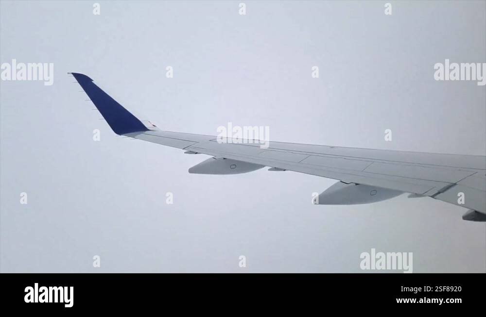 Wing of Airplane Flying Through Fog and Clouds Stock Video Footage - Alamy