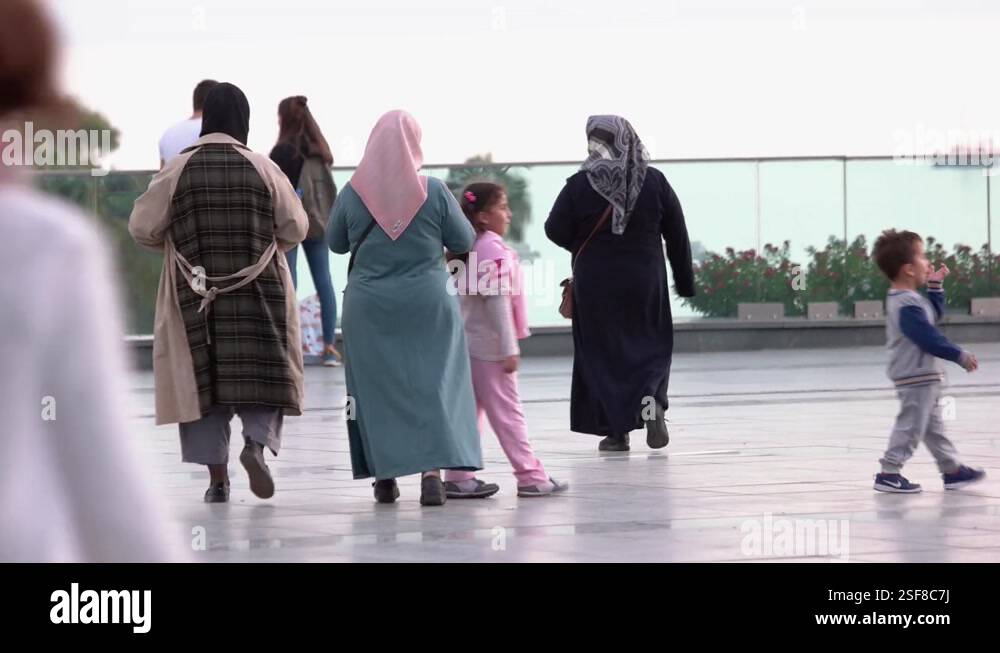 Muslim tourists walking on the street on a summer day Stock Video ...