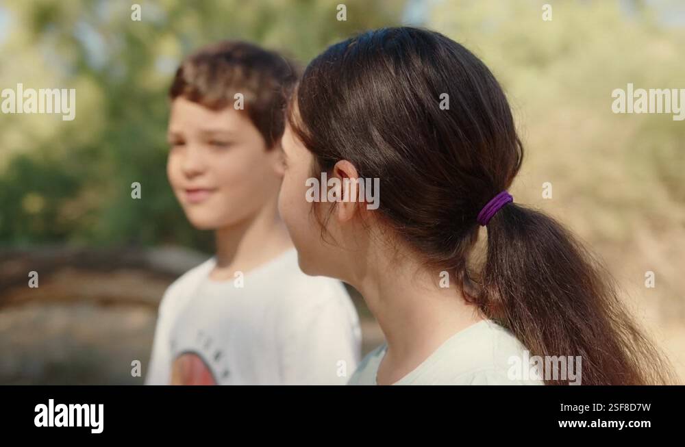 Brother and sister nod their head in agreement and smiling in the ...