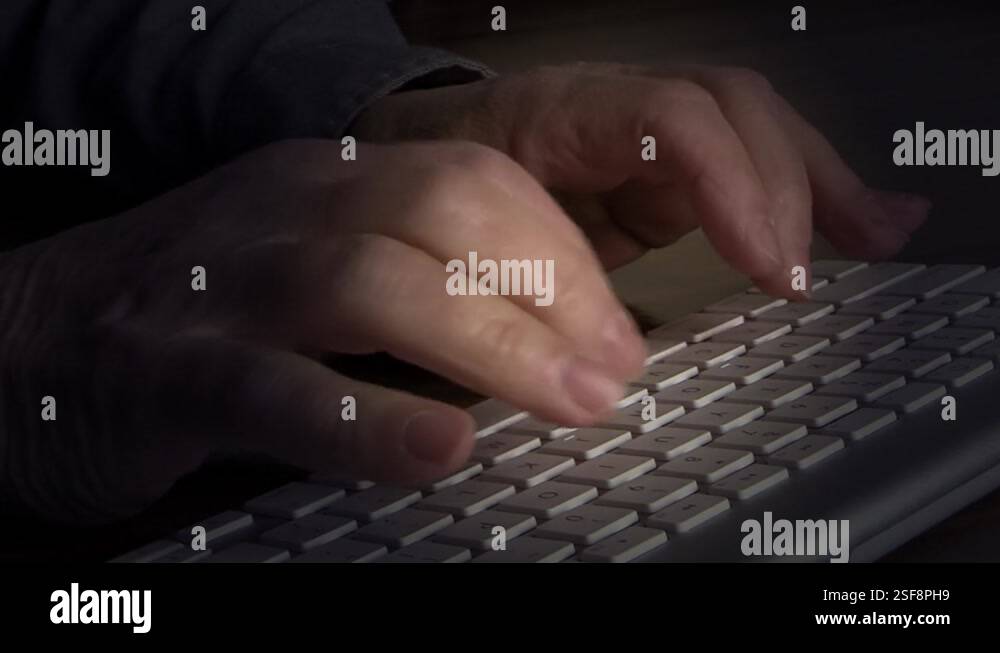 Rapidly typing on a computer keyboard Stock Video Footage - Alamy