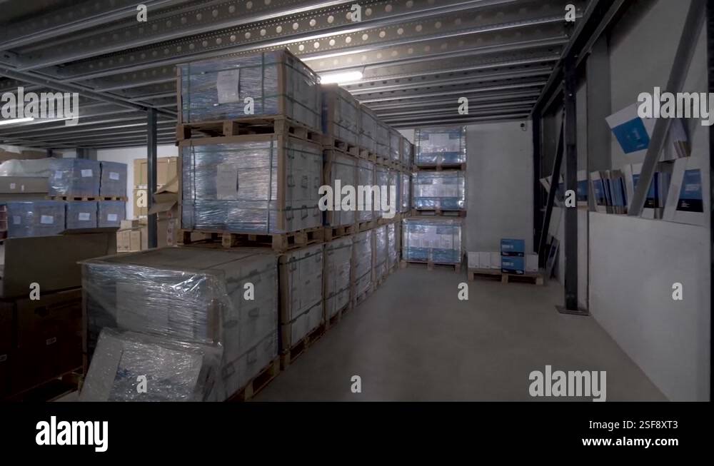 Solar panel warehouse with forklift near the loading bay with crates ...