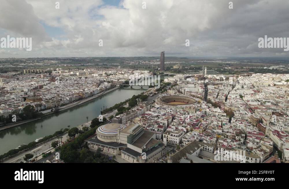 Guadalquivir river crossing Seville historical center with Plaza de ...