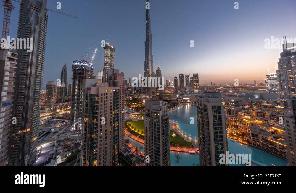 Dubai Downtown cityscape with tallest skyscrapers around aerial night ...
