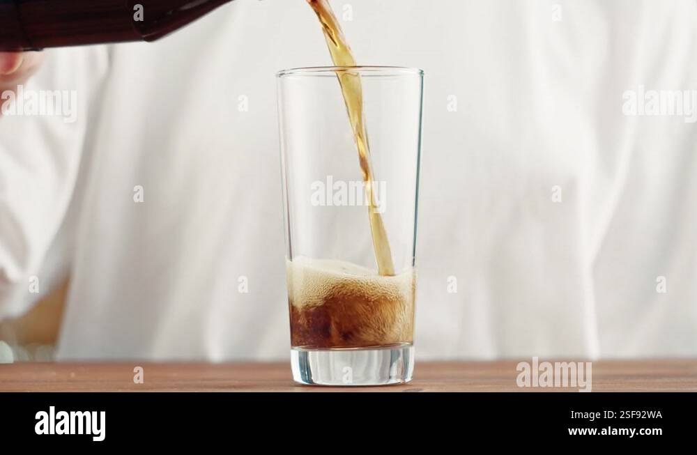 Coca cola in glass mug close-up. Drinking fizz sweet carbonated soft ...