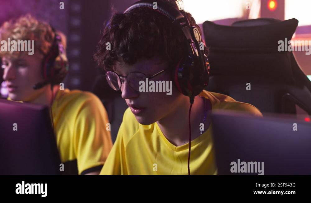 Teen gamer celebrating victory in video game with team Stock Video ...