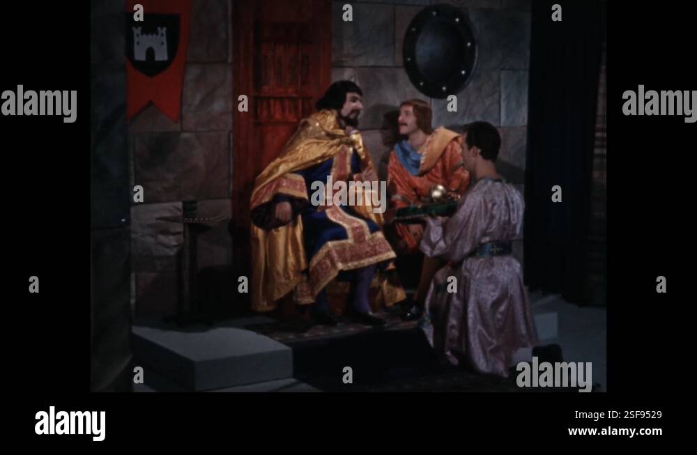 1960s: King talking with confidante, takes sword and scepter from ...