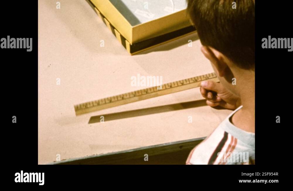 1950s: Boy picks up ruler. Boy speaks and picks up screwdriver. Boy ...