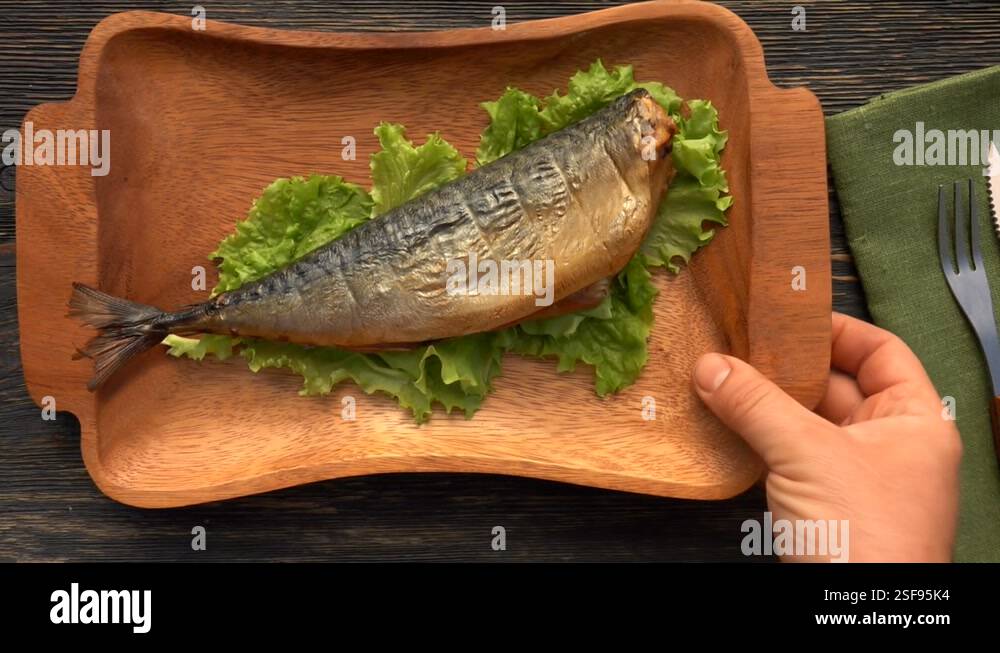 Top view of the hands placing plate with a delicious juicy grilled red ...