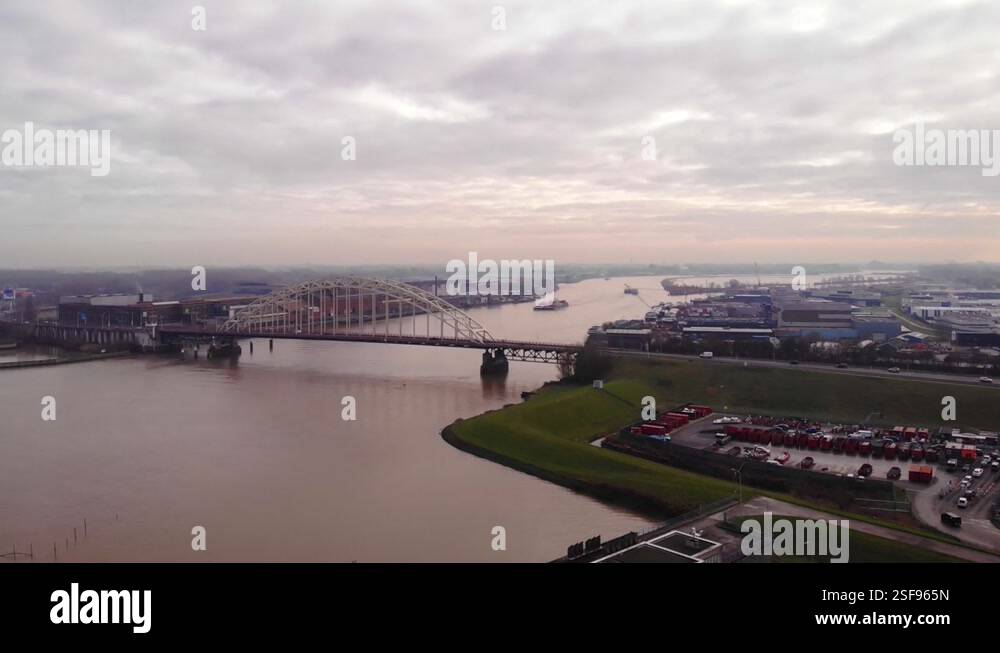 Aerial Over Alblasserdam With View Of Bridge over the Noord. Dolly ...