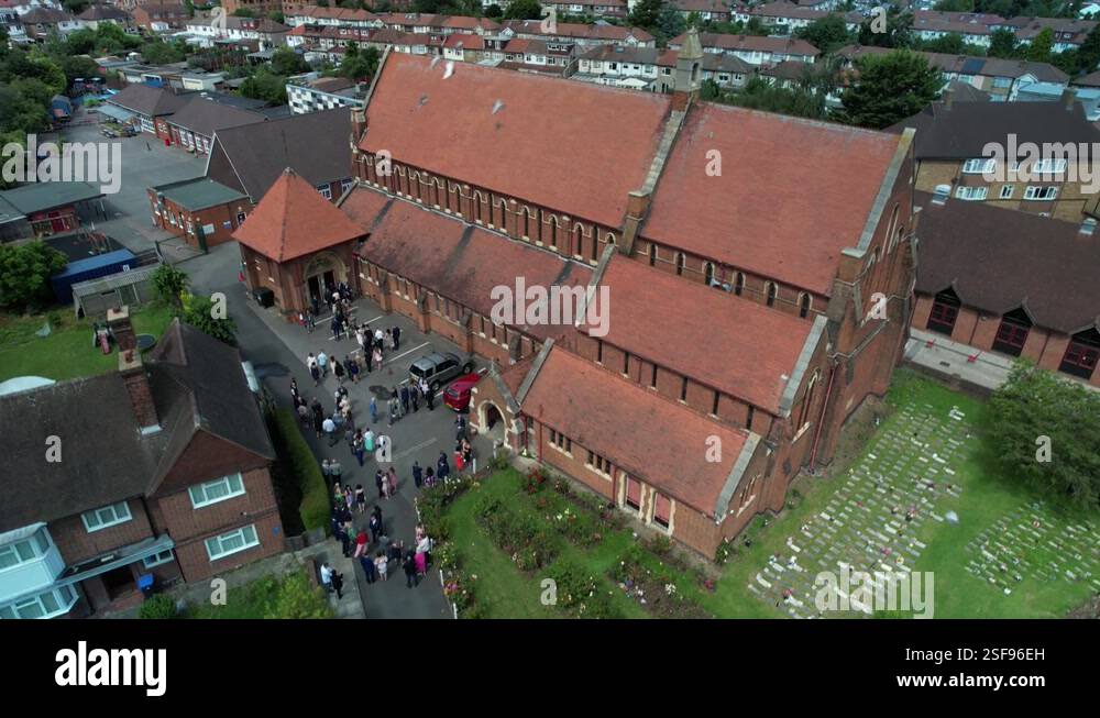 Romantic wedding ceremony aerial rising view above St. George's church ...